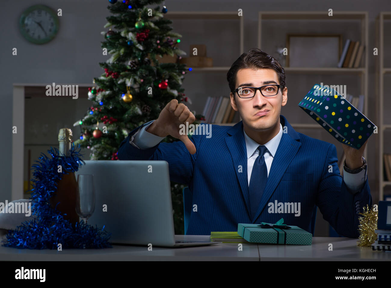 Businessman working late on christmas day in office Stock Photo - Alamy