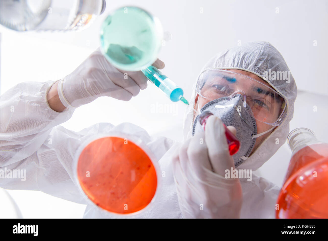 Chemist working in the laboratory with hazardous chemicals Stock Photo ...