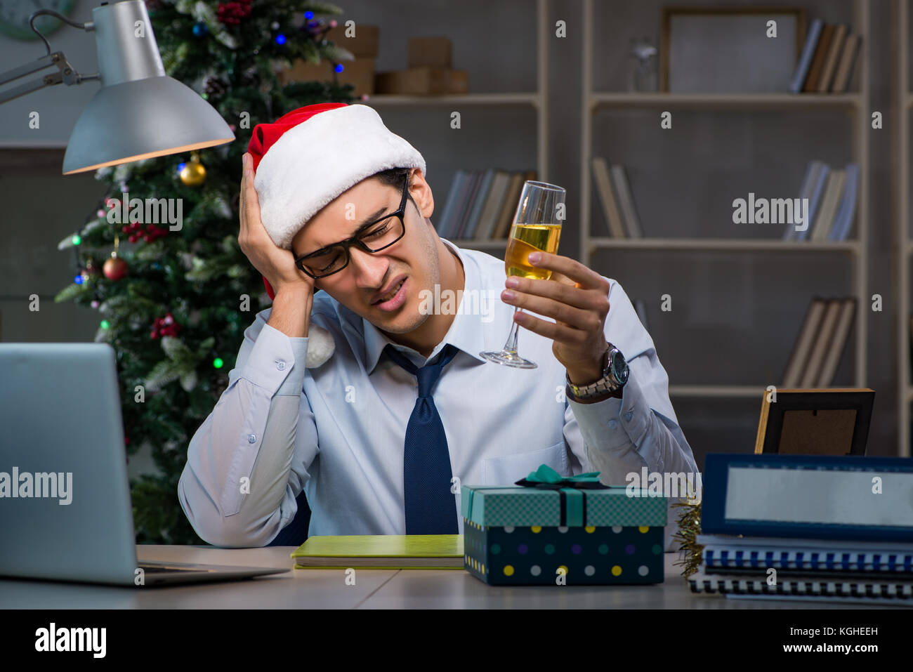 Businessman working late on christmas day in office Stock Photo - Alamy