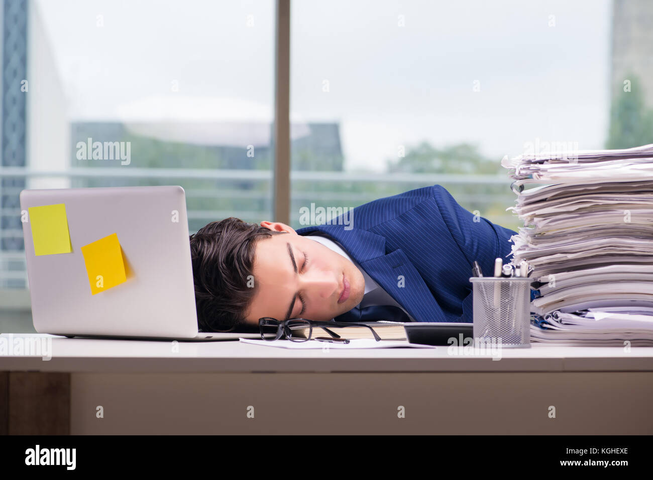 Workaholic businessman overworked with too much work in office Stock ...