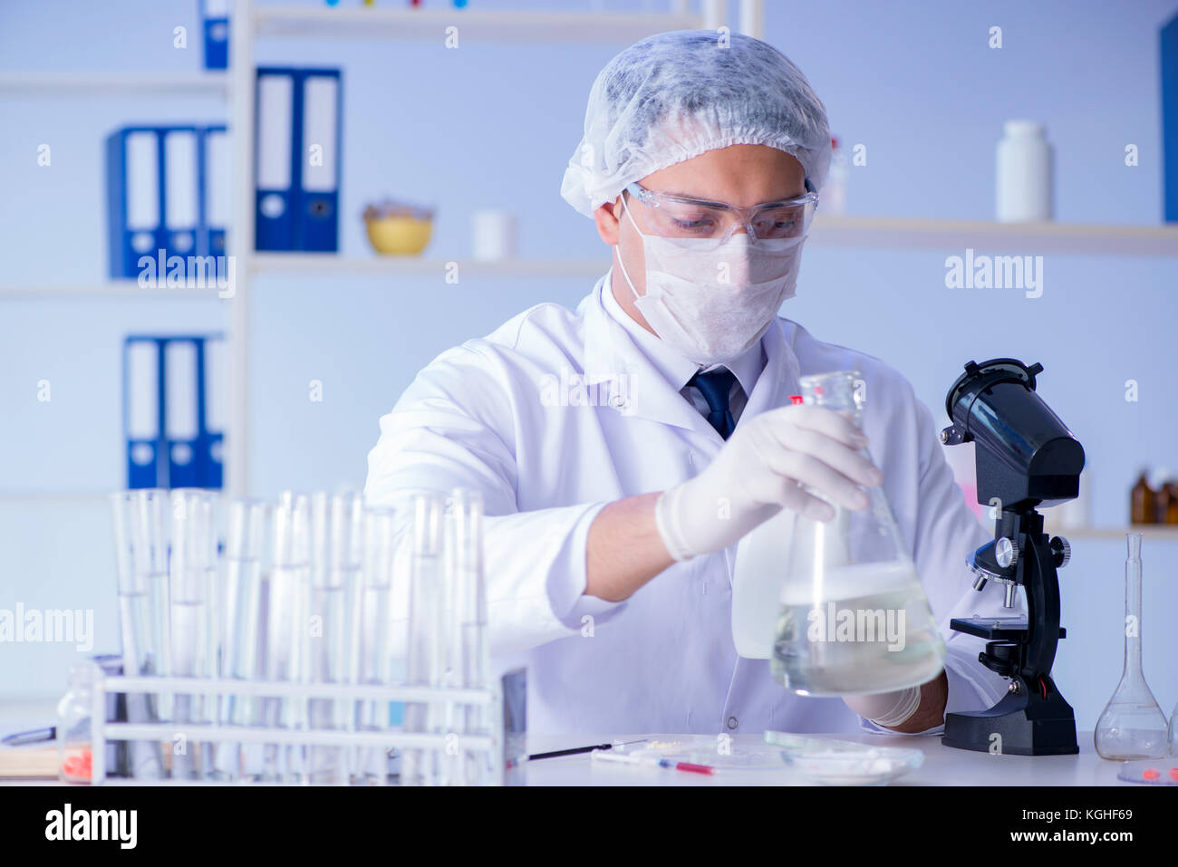 Man in the lab testing new cleaning solution detergent Stock Photo - Alamy