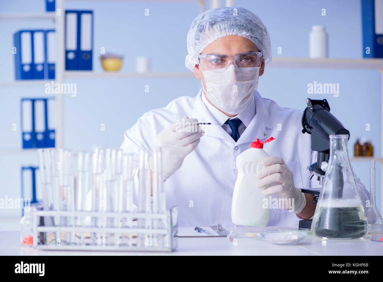 Man in the lab testing new cleaning solution detergent Stock Photo - Alamy