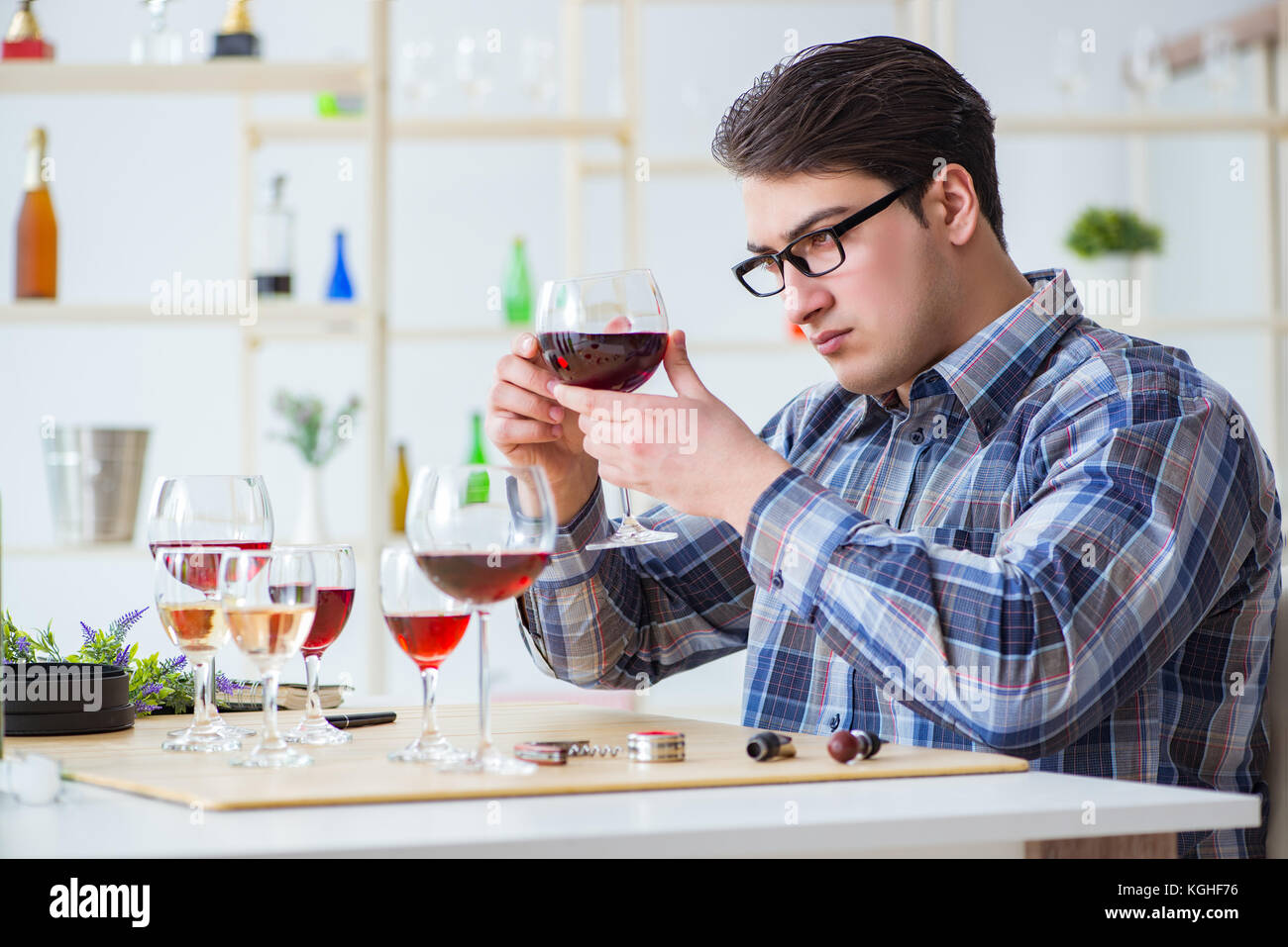 Professional sommelier tasting red wine Stock Photo - Alamy
