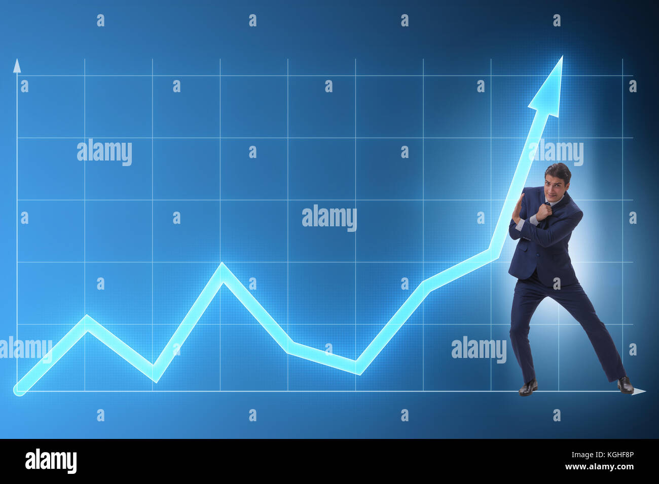 Businessman trying to help economic growth in business concept Stock ...