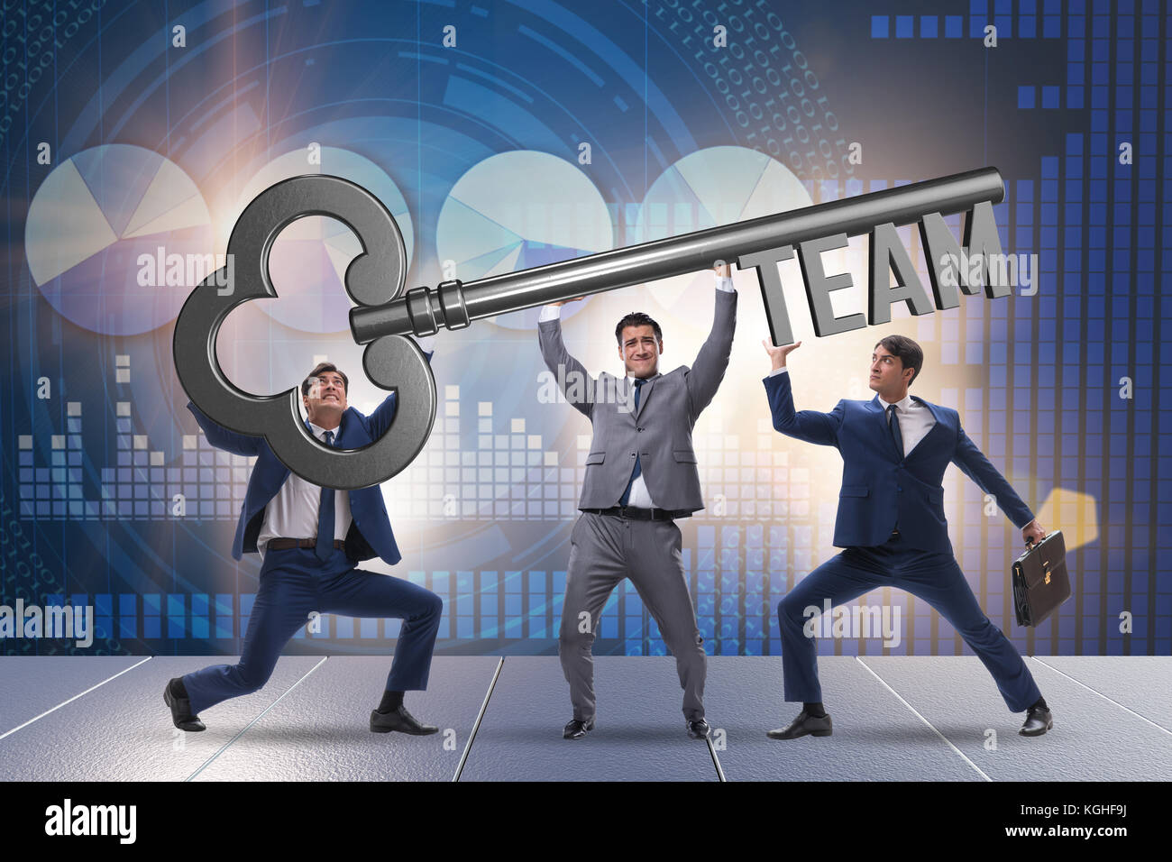 Businessmen holding giant key in team concept Stock Photo - Alamy