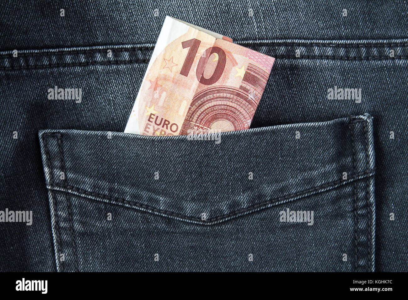 Ten Euro in a back pocket of black jeans Stock Photo - Alamy