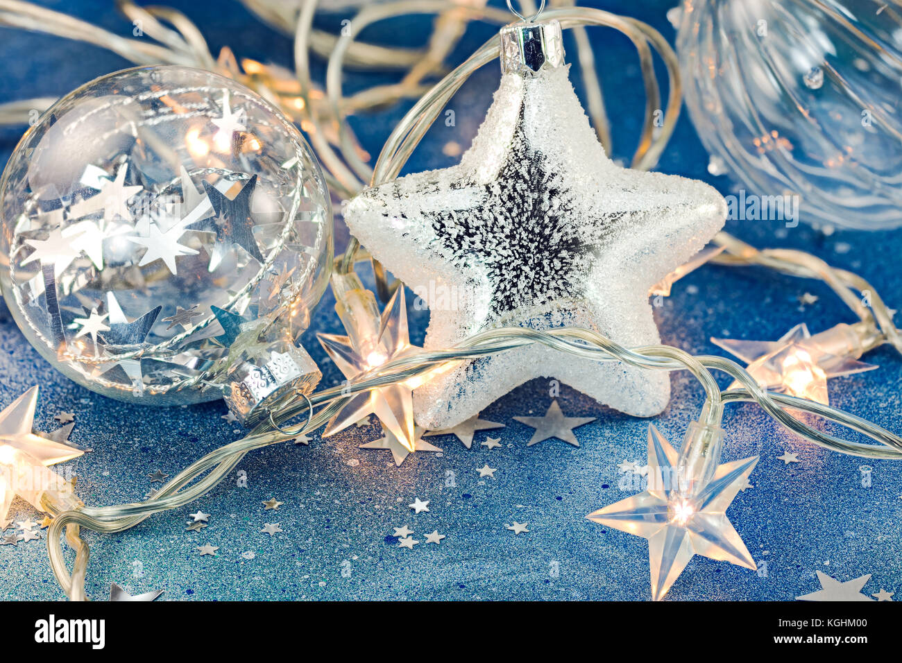 glass balls with silver star for christmas tree and holiday lights on ...