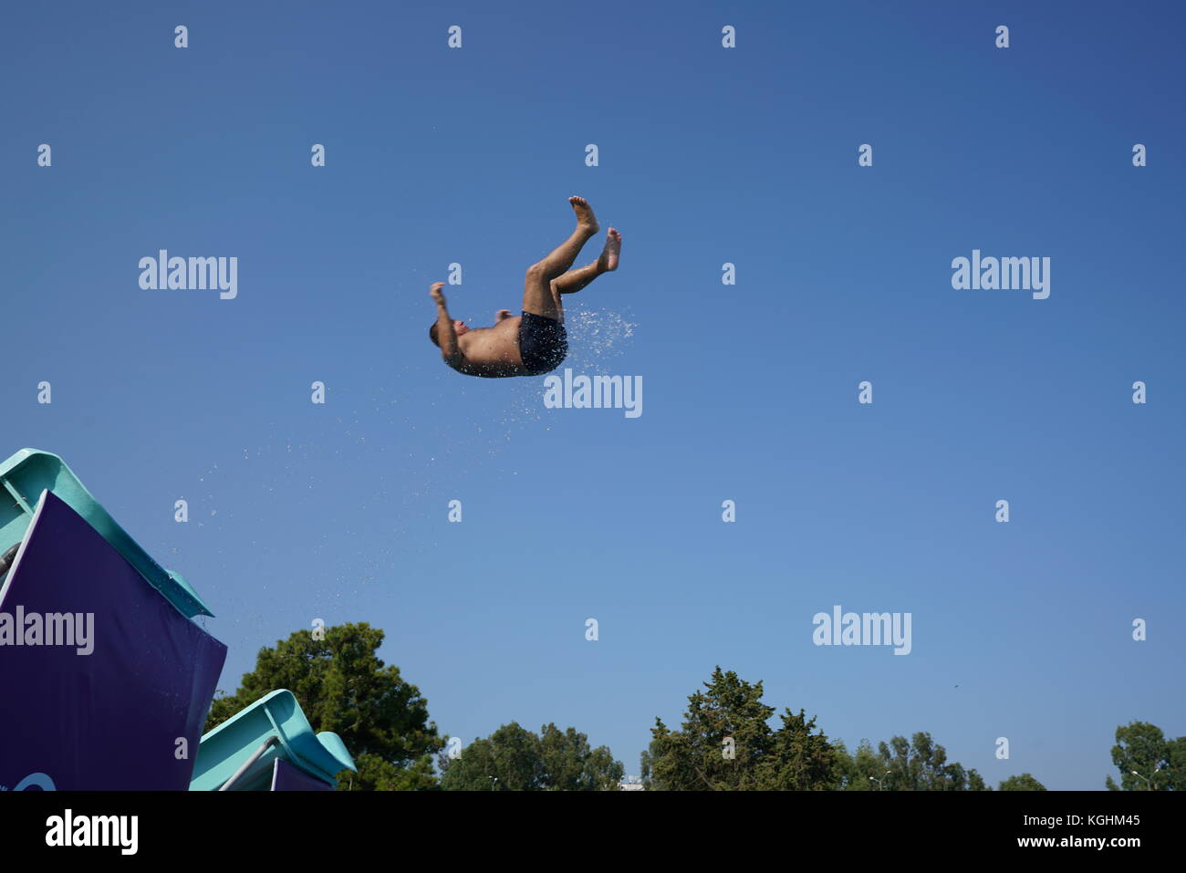 High diving: jumping in the air and flying in swimsuit Stock Photo - Alamy
