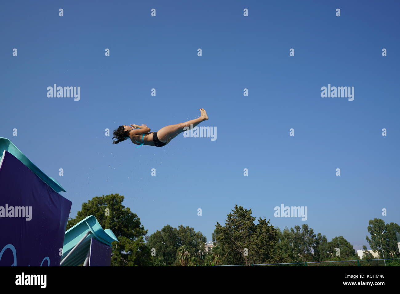 High diving: jumping in the air and flying in swimsuit Stock Photo - Alamy