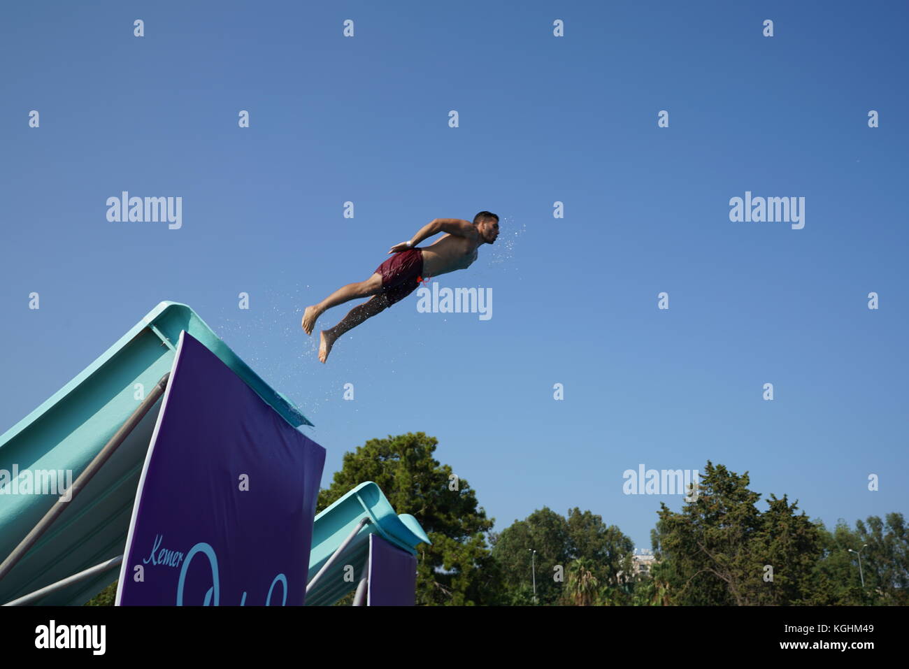 High diving: jumping in the air and flying in swimsuit Stock Photo - Alamy