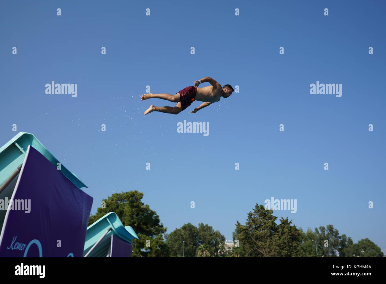 High diving: jumping in the air and flying in swimsuit Stock Photo - Alamy