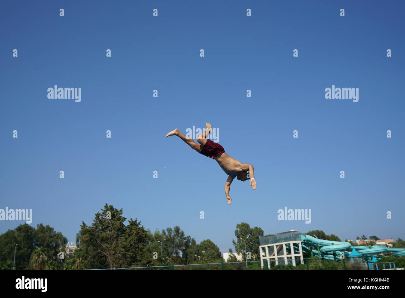 High diving: jumping in the air and flying in swimsuit Stock Photo - Alamy