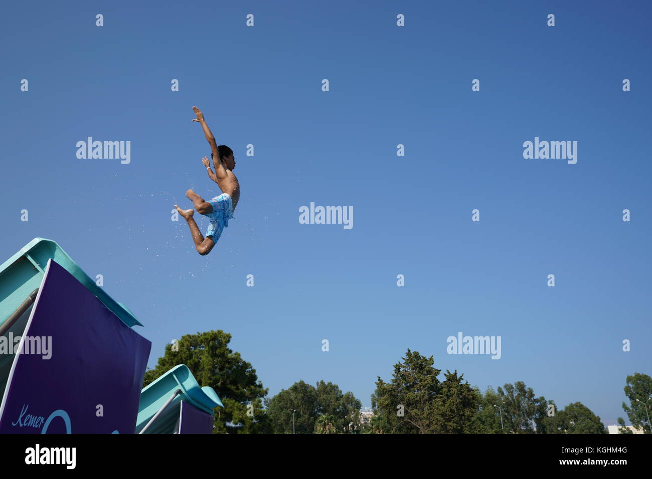 High diving: jumping in the air and flying in swimsuit Stock Photo - Alamy