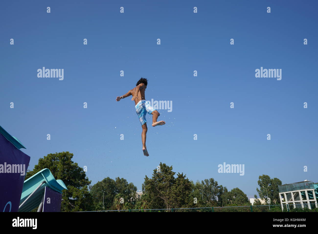High diving: jumping in the air and flying in swimsuit Stock Photo - Alamy
