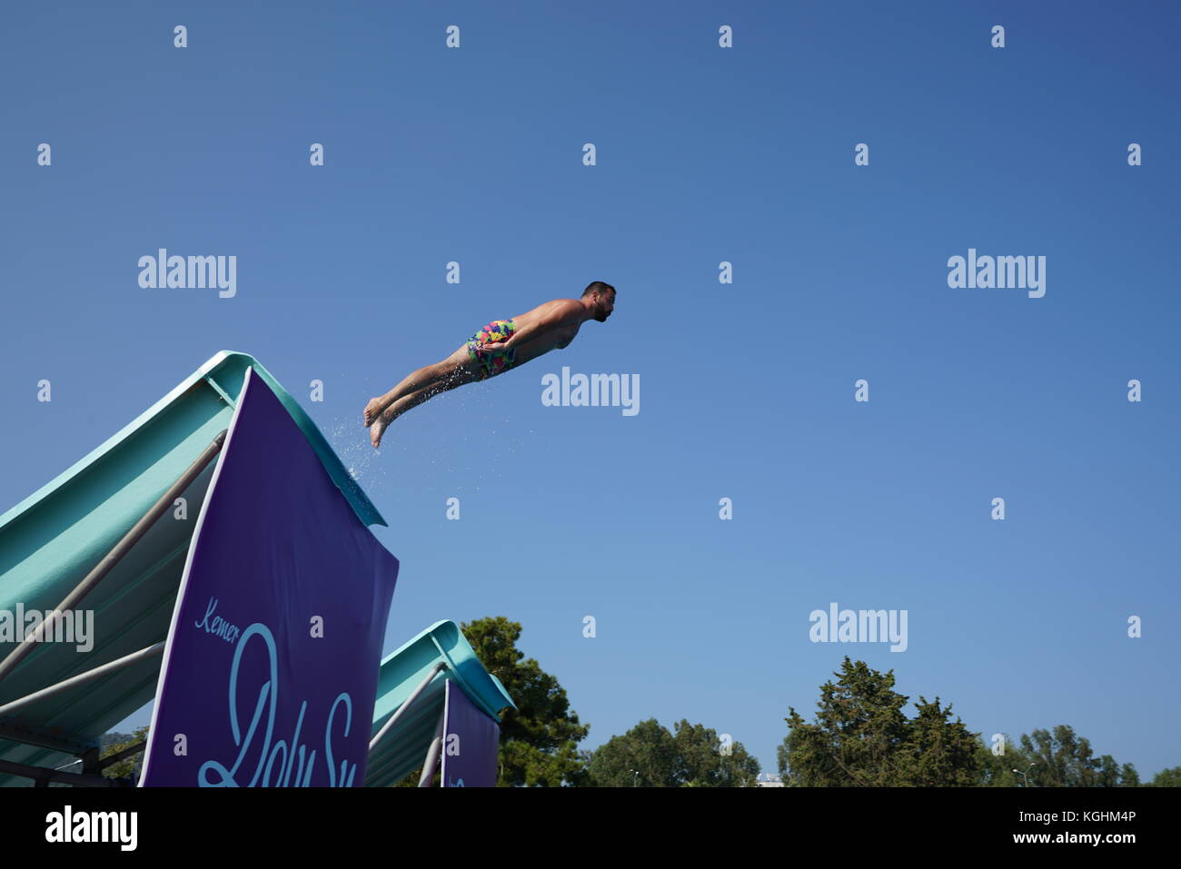 High diving: jumping in the air and flying in swimsuit Stock Photo - Alamy