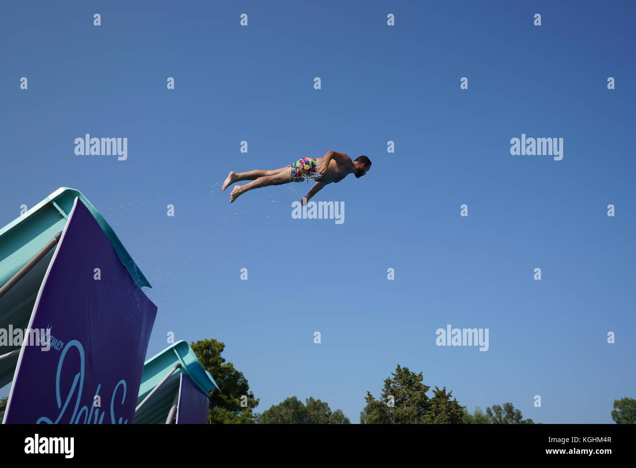 High diving: jumping in the air and flying in swimsuit Stock Photo - Alamy