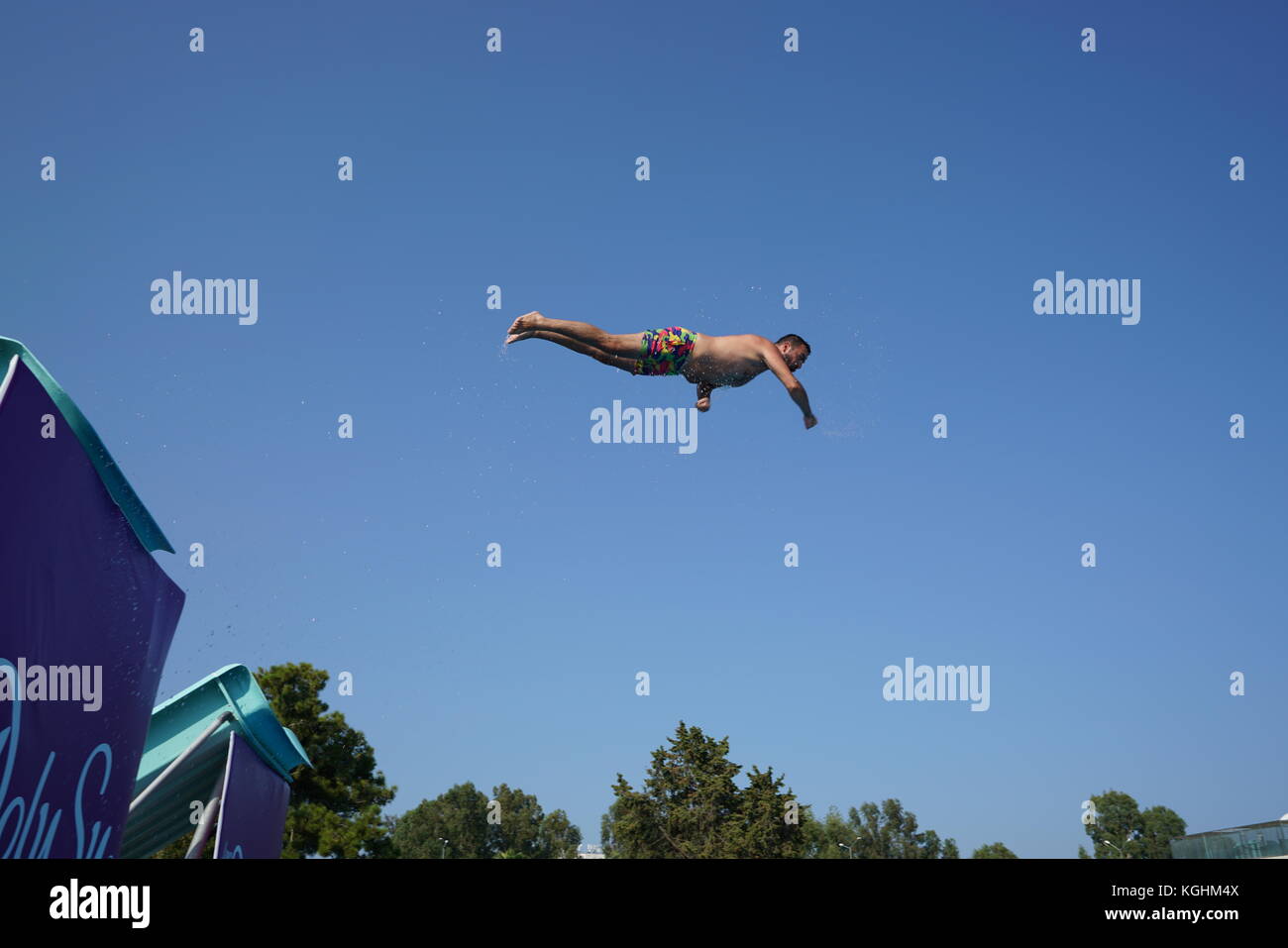 High diving: jumping in the air and flying in swimsuit Stock Photo - Alamy