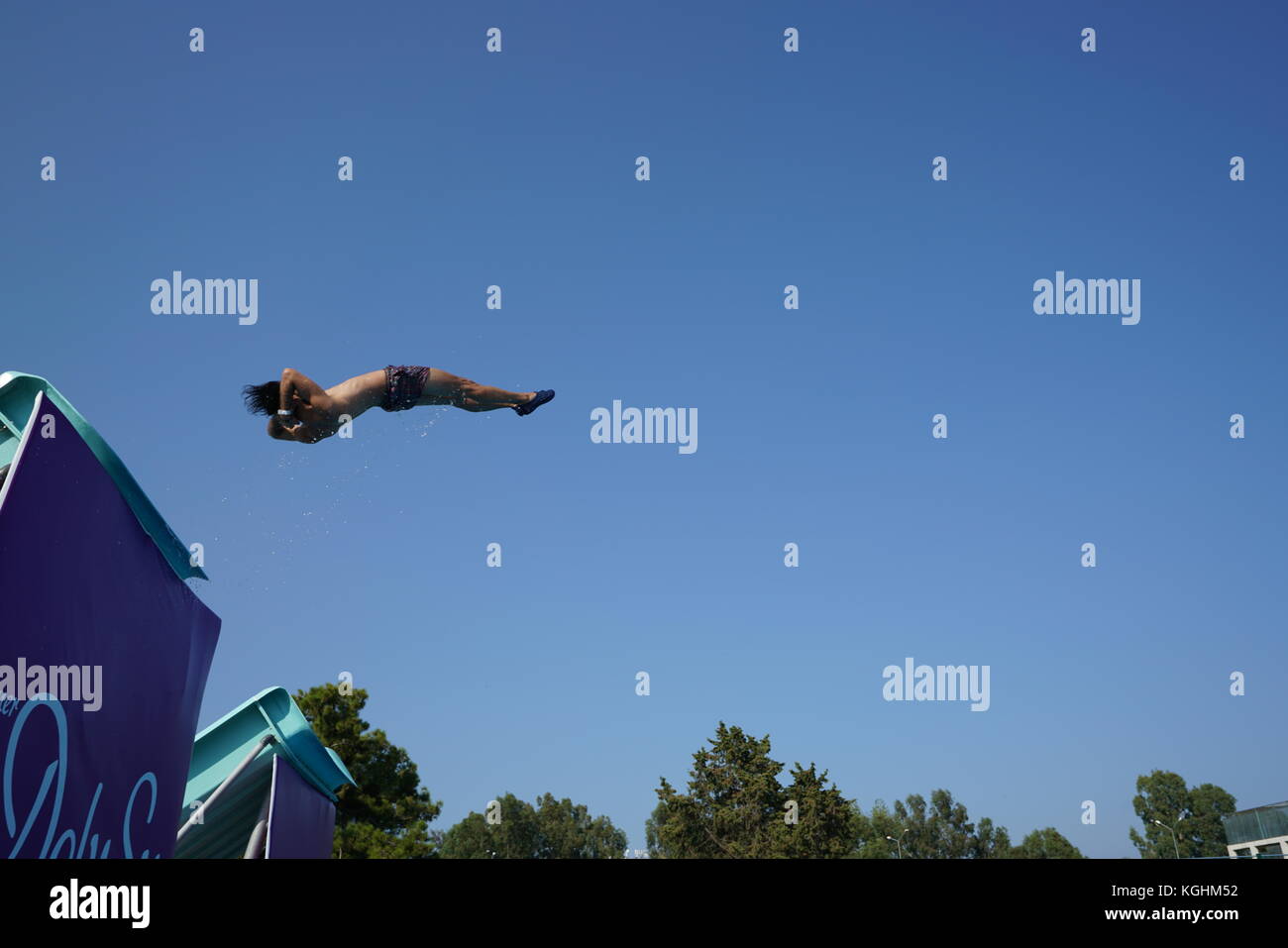 High diving: jumping in the air and flying in swimsuit Stock Photo - Alamy