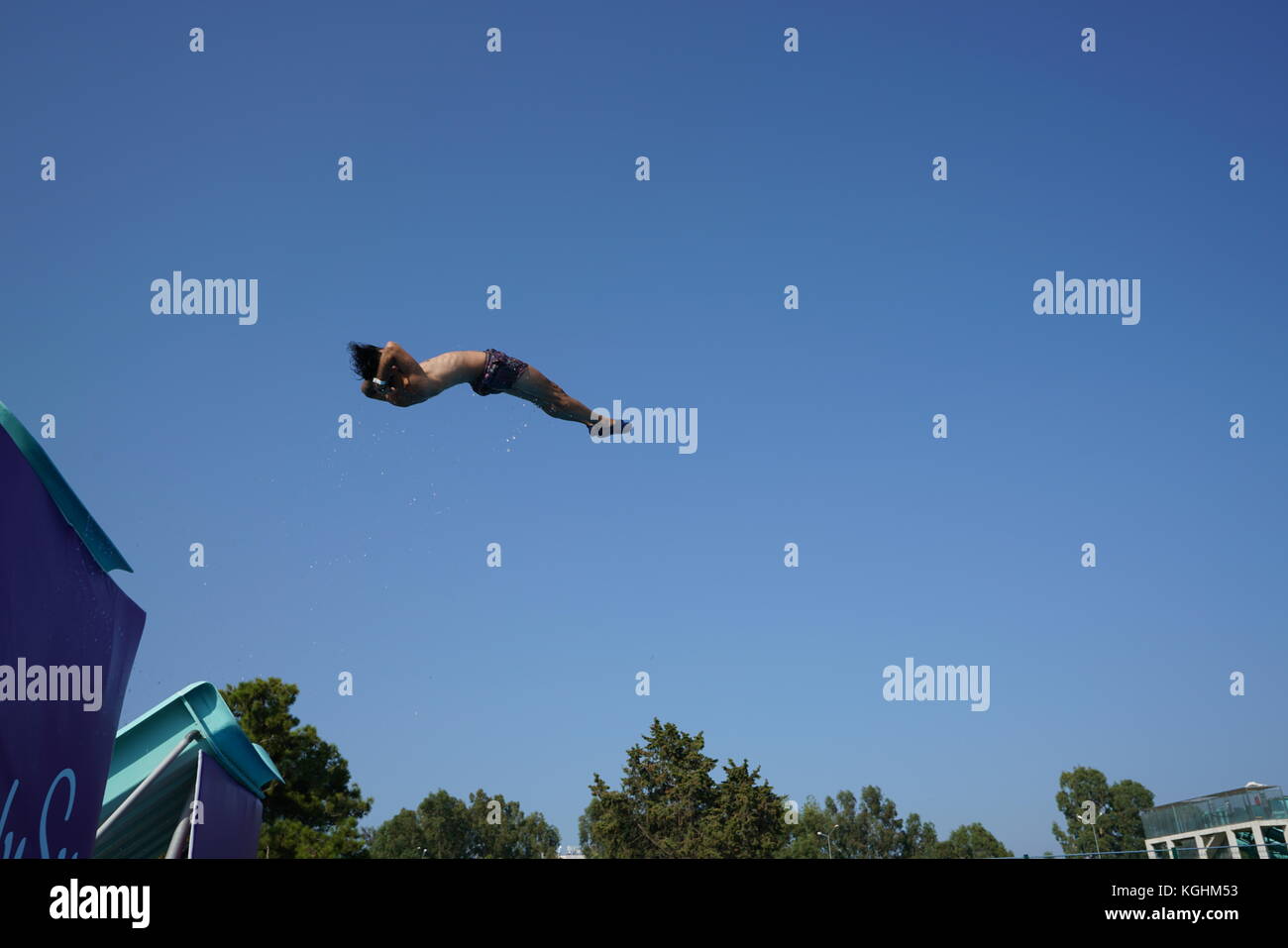 High diving: jumping in the air and flying in swimsuit Stock Photo - Alamy