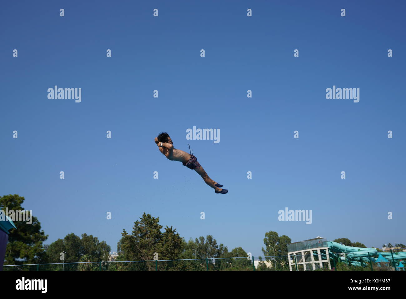 High diving: jumping in the air and flying in swimsuit Stock Photo - Alamy