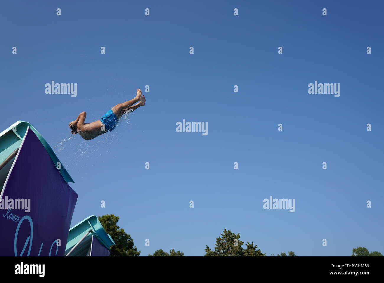 High diving: jumping in the air and flying in swimsuit Stock Photo - Alamy