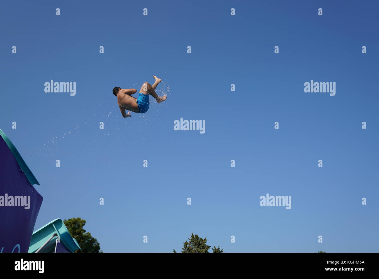 High diving: jumping in the air and flying in swimsuit Stock Photo - Alamy