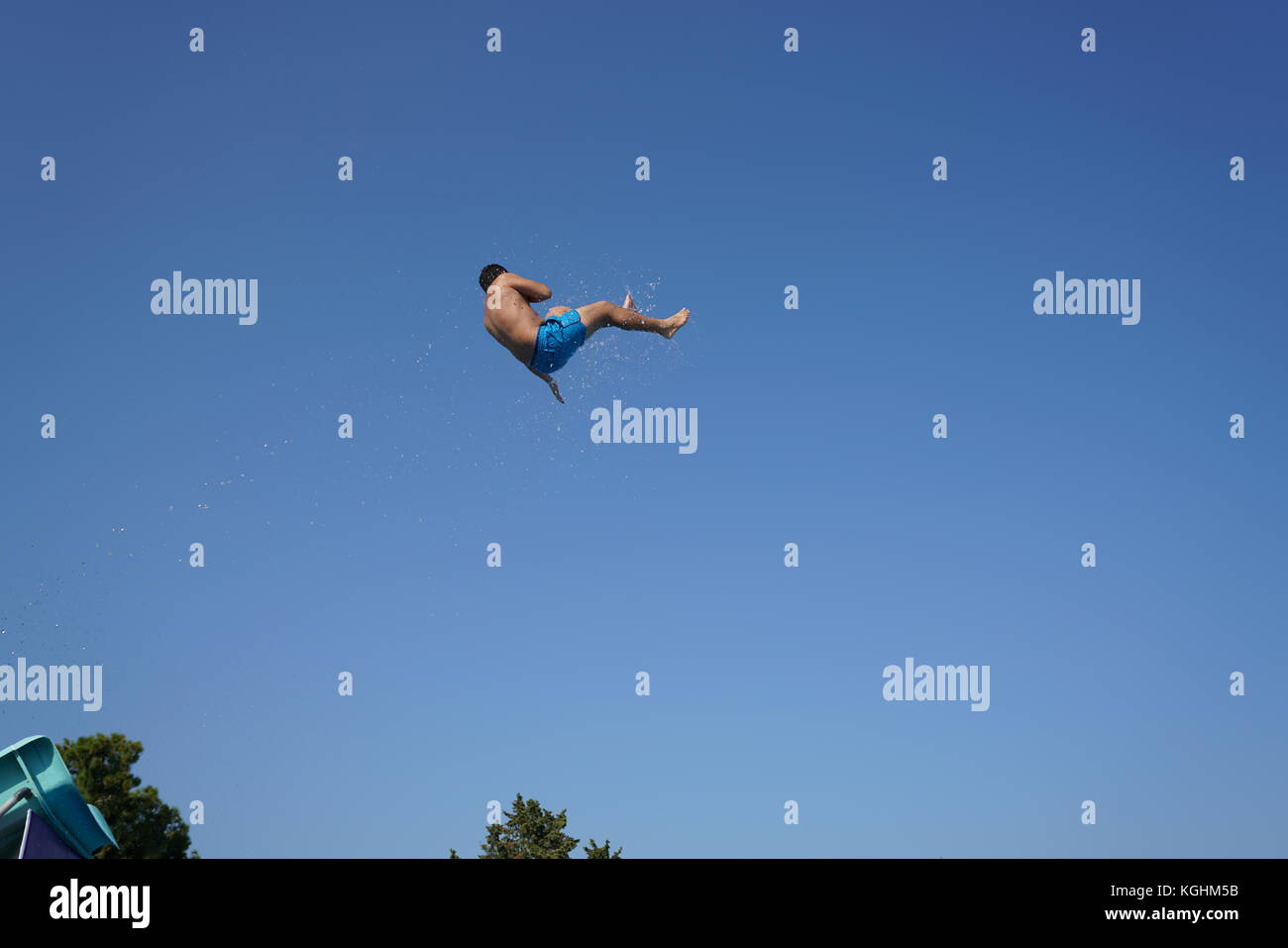 High diving: jumping in the air and flying in swimsuit Stock Photo - Alamy