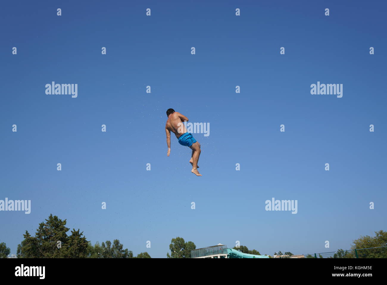 High diving: jumping in the air and flying in swimsuit Stock Photo - Alamy