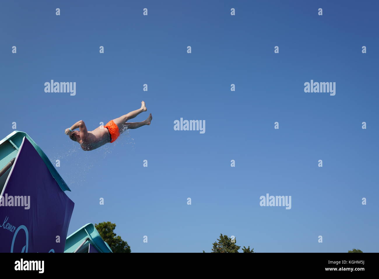 High diving: jumping in the air and flying in swimsuit Stock Photo - Alamy