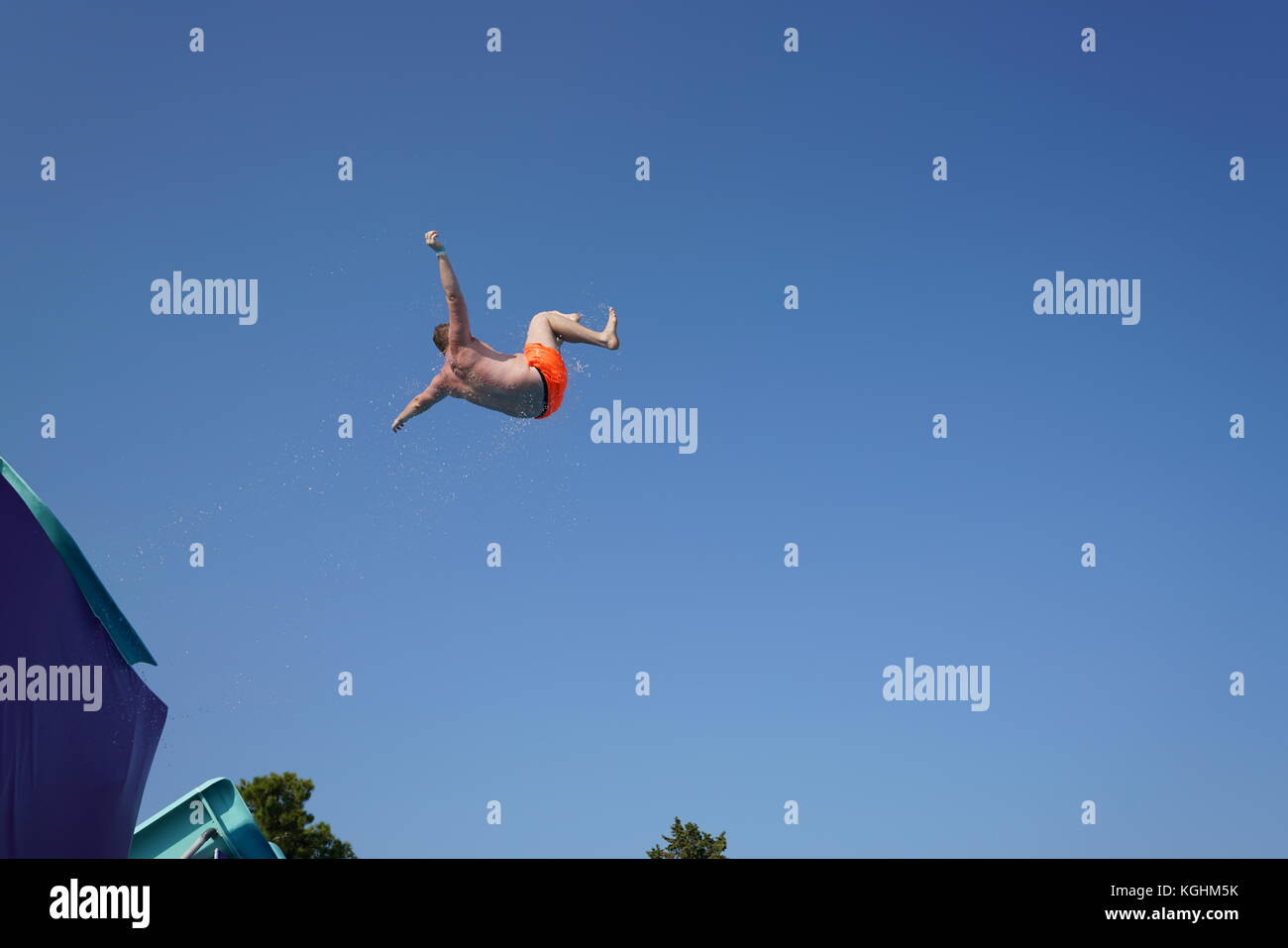 High diving: jumping in the air and flying in swimsuit Stock Photo - Alamy