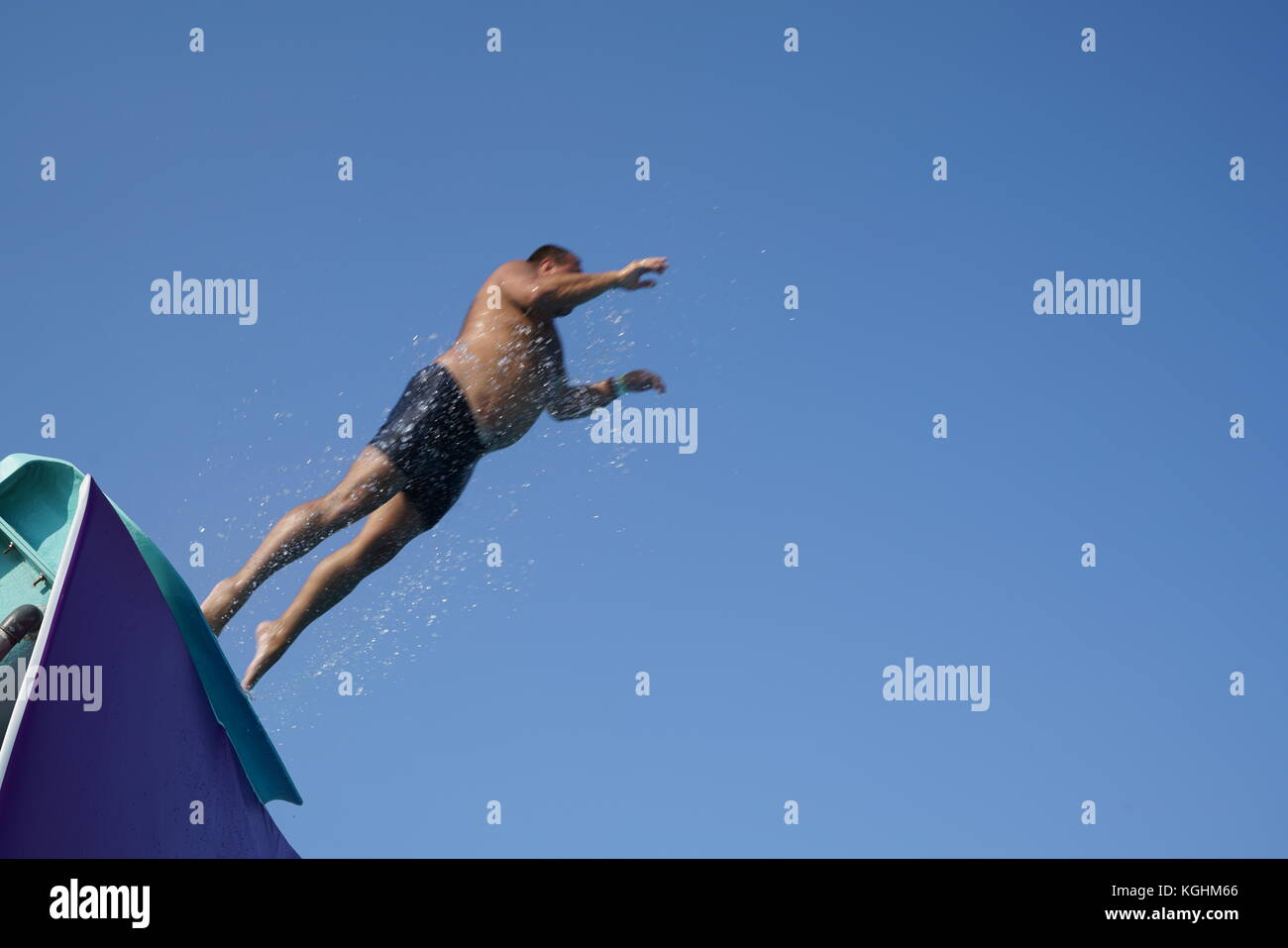 High diving: jumping in the air and flying in swimsuit Stock Photo - Alamy
