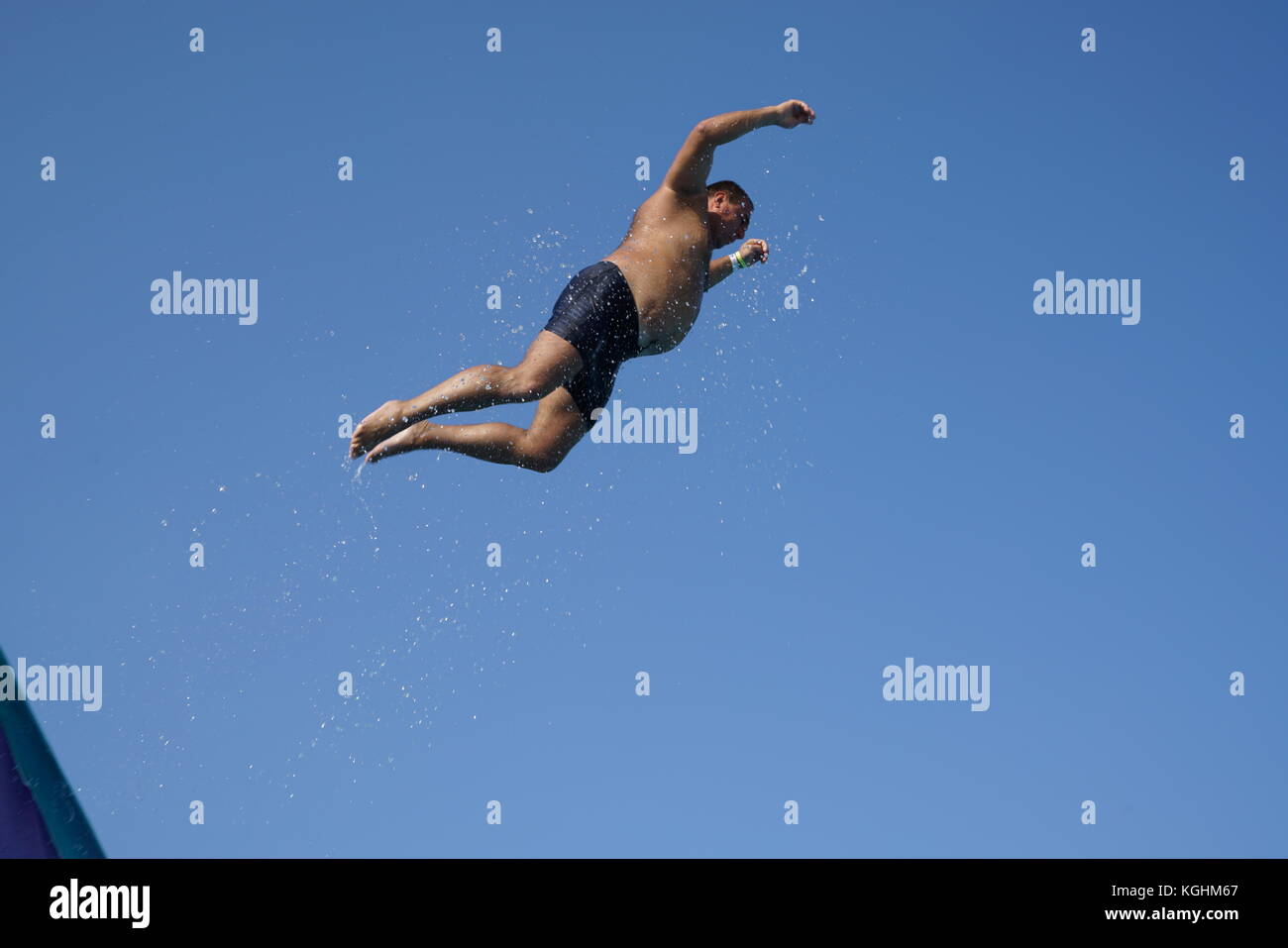 High diving: jumping in the air and flying in swimsuit Stock Photo - Alamy