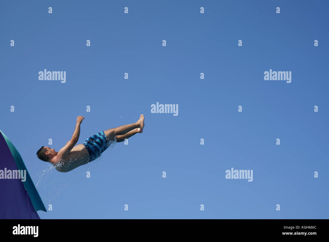 High diving: jumping in the air and flying in swimsuit Stock Photo - Alamy