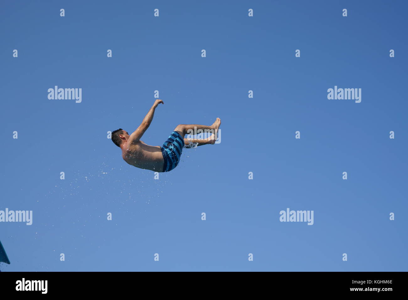 High diving: jumping in the air and flying in swimsuit Stock Photo - Alamy