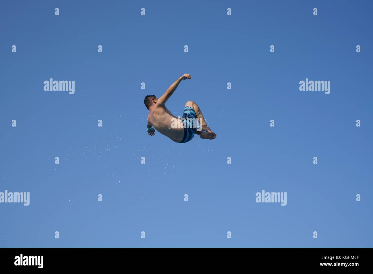 High diving: jumping in the air and flying in swimsuit Stock Photo - Alamy