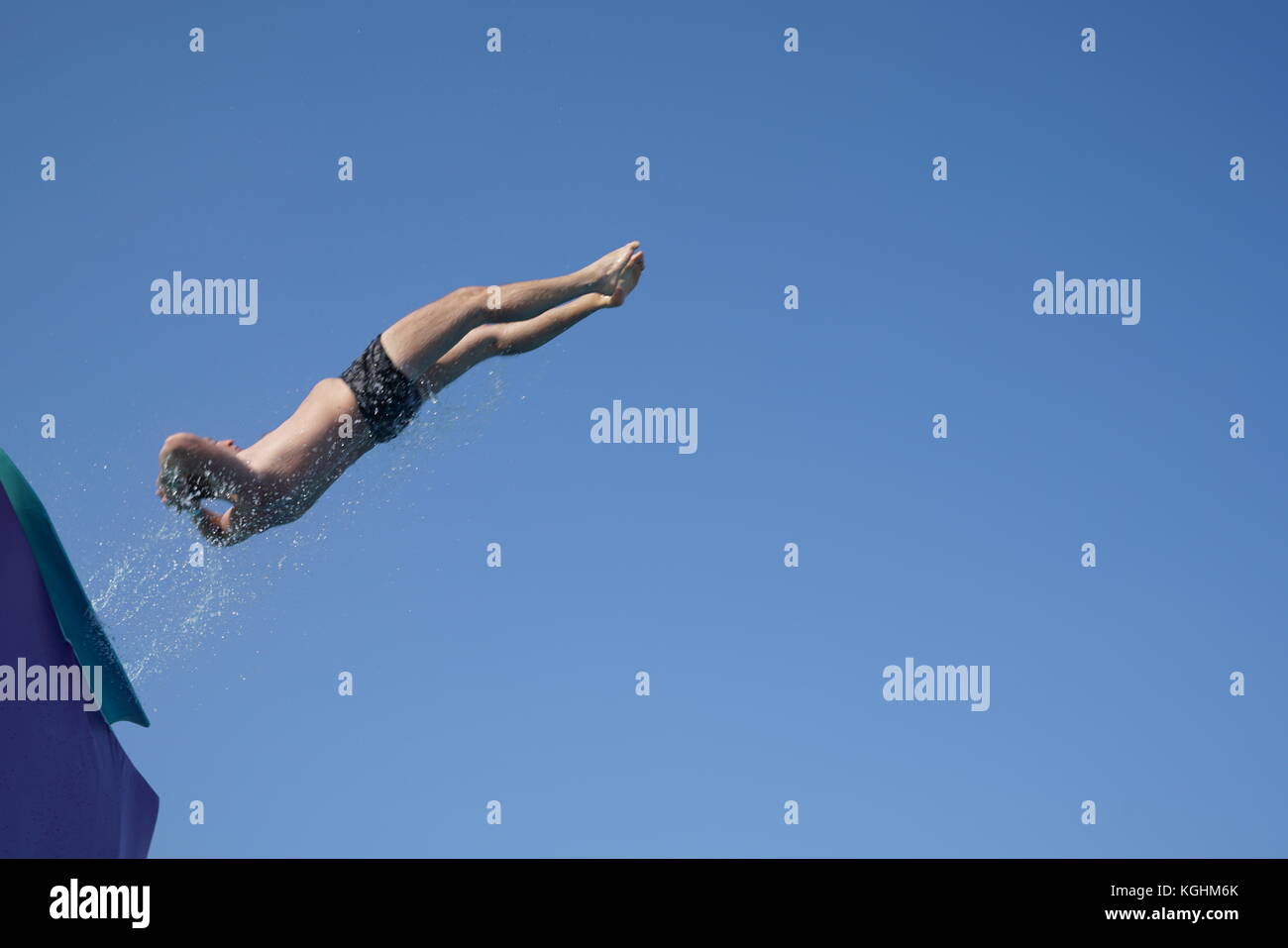 High diving: jumping in the air and flying in swimsuit Stock Photo - Alamy
