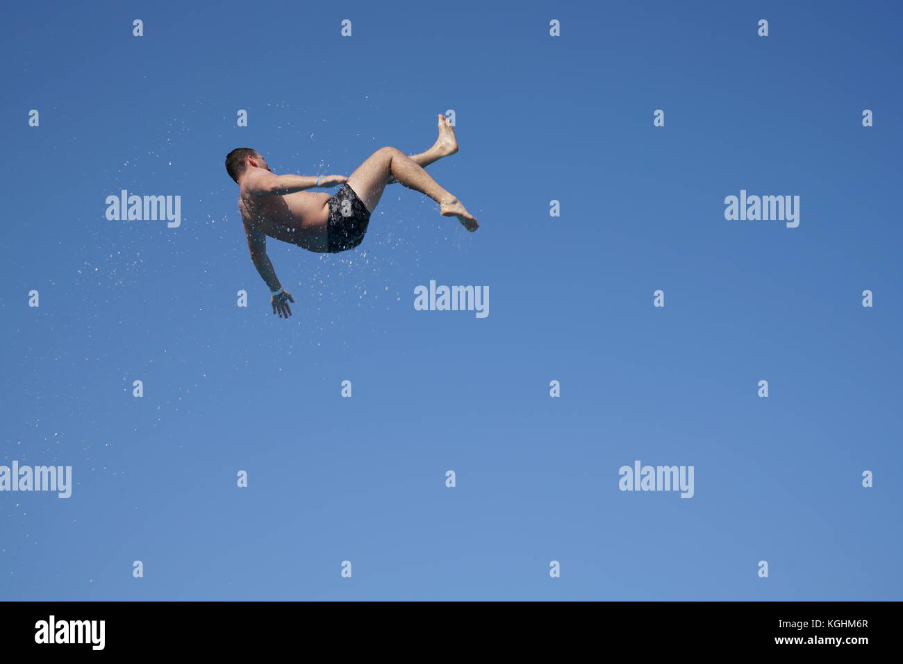 High diving: jumping in the air and flying in swimsuit Stock Photo - Alamy
