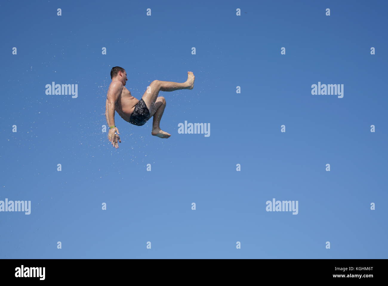 High diving: jumping in the air and flying in swimsuit Stock Photo - Alamy