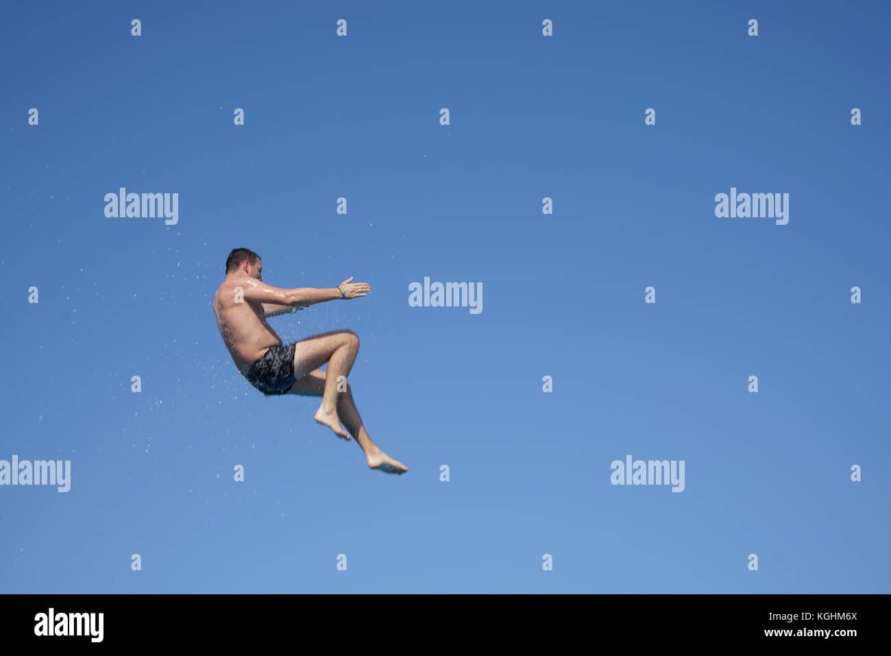 High diving: jumping in the air and flying in swimsuit Stock Photo - Alamy