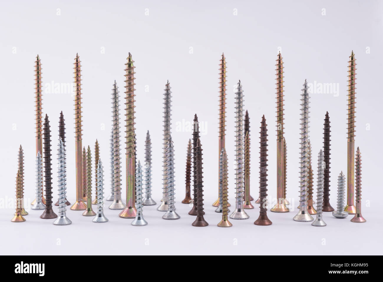 Some screws on a white background Stock Photo - Alamy