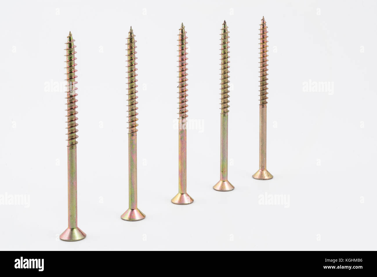 Some screws on a white background Stock Photo - Alamy