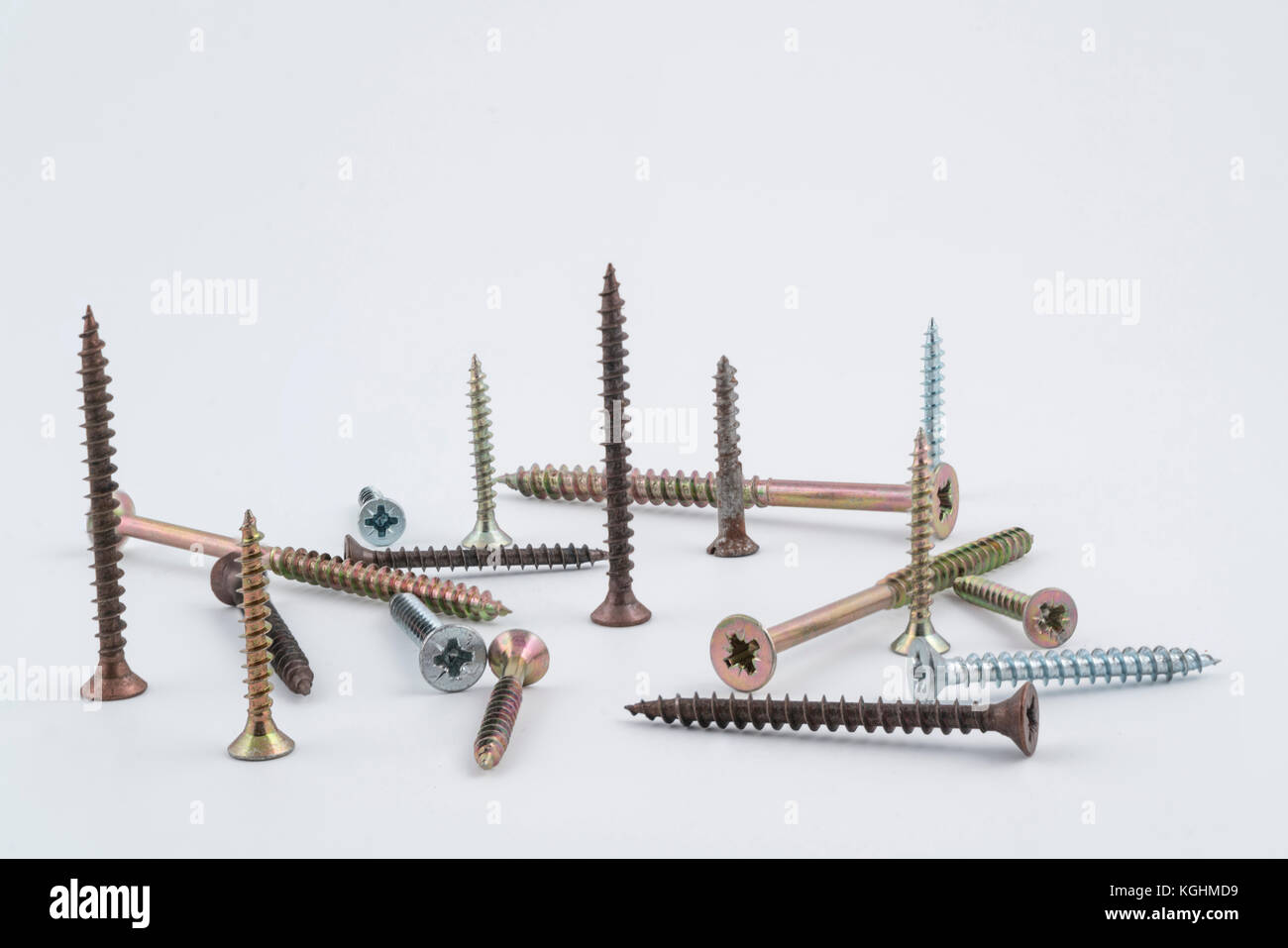 Some screws on a white background Stock Photo - Alamy