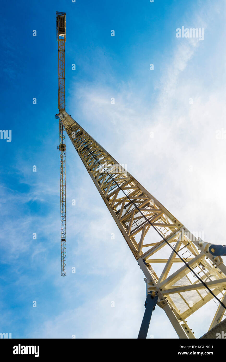 Construction crane working on the construction of a skyscraper in ...