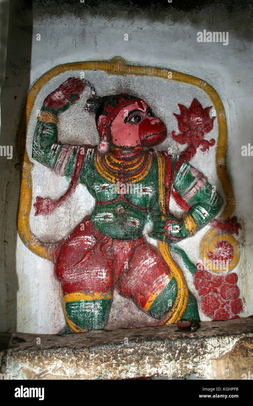 Colourful stone idol of Monkey God Hanuman at temple in Hampi ...