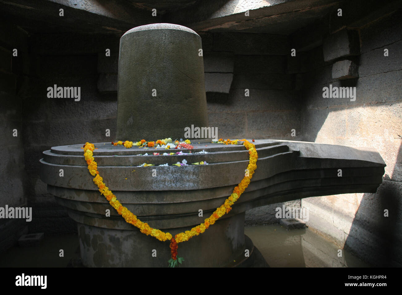 Shivalinga called Badavi Linga garlanded after performing puja at Hampi ...