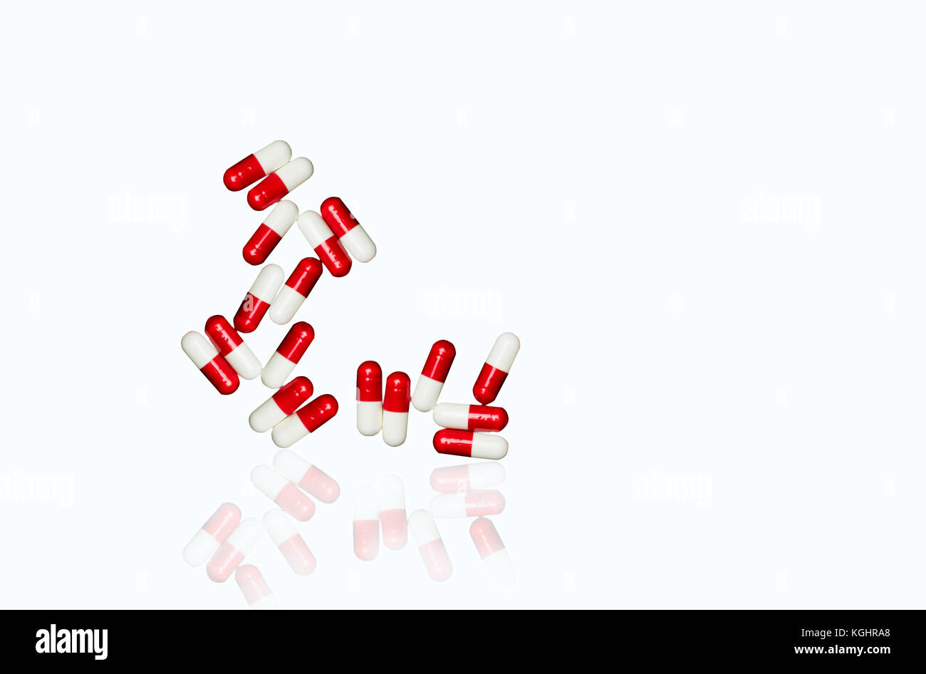 Red, white antibiotic capsules pills isolated on white background with ...