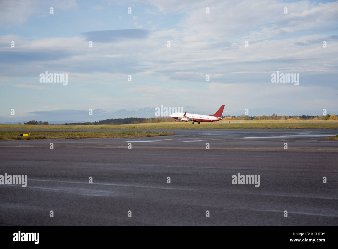 Airplane Taking Off From Wet Runway Stock Photo - Alamy