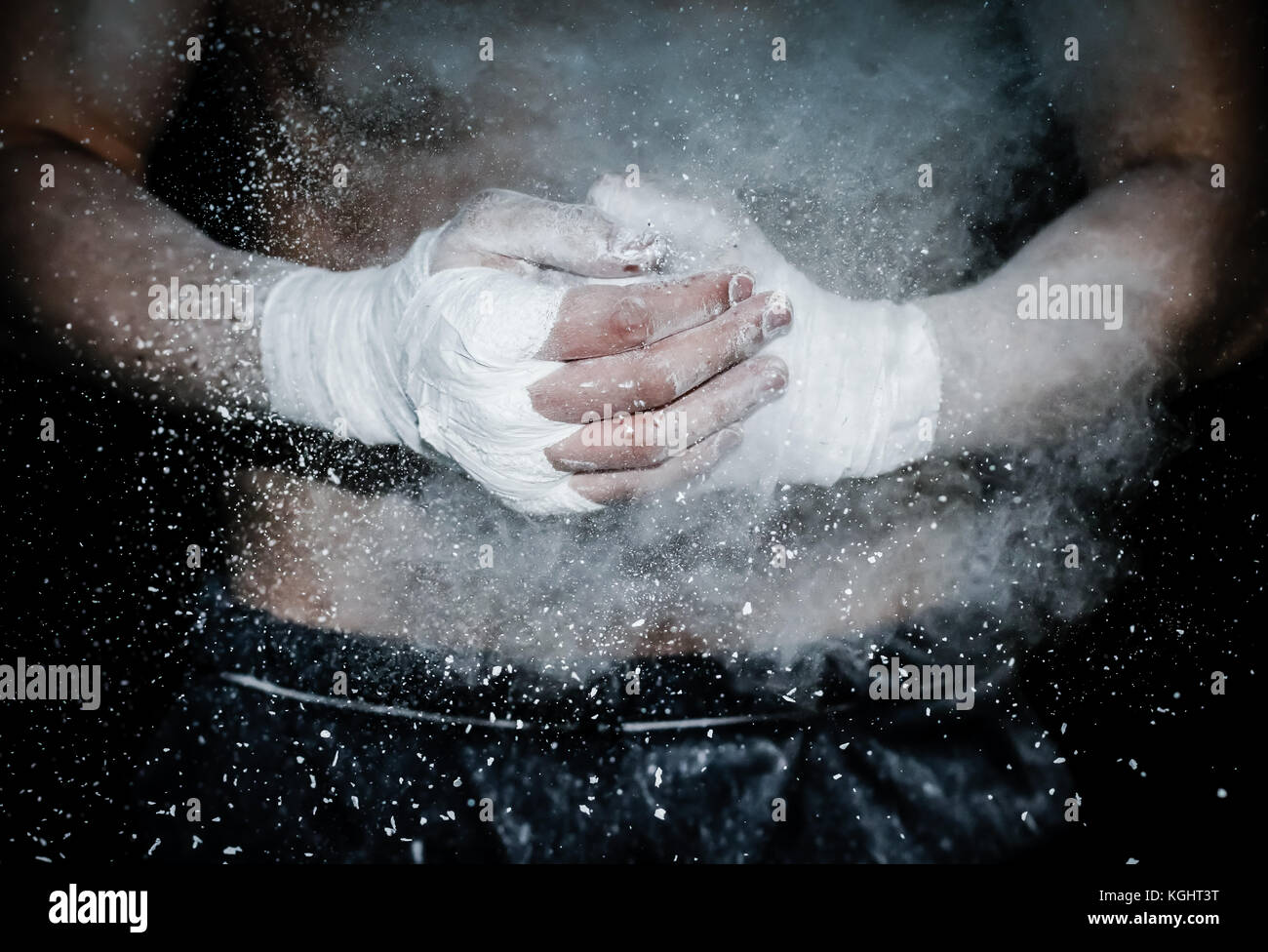 Hands wrapped for boxing ready to fight with chalk explosion Stock ...