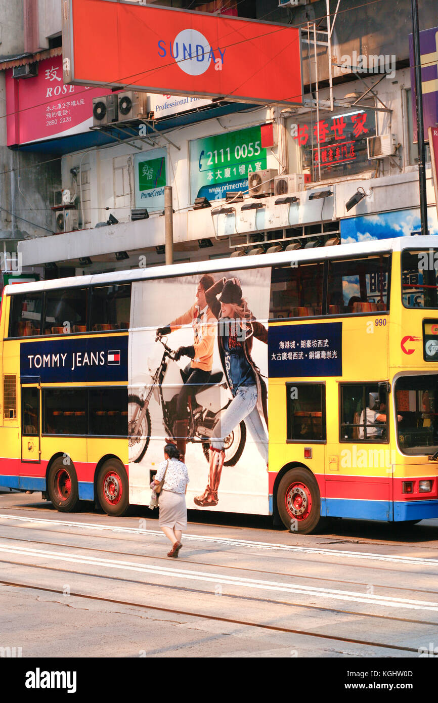 Yellow double-decker trolley-bus with advertising, Hong Kong, China ...