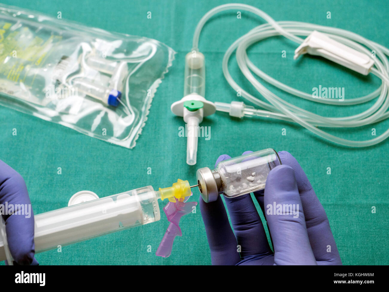 Doctor preparing medication to inject, conceptual image Stock Photo - Alamy